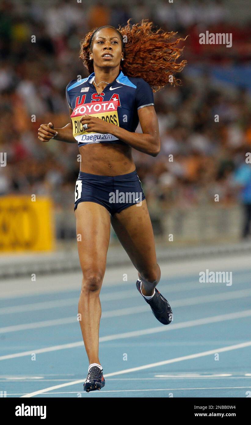 USA's Sanya Richards-Ross crosses the finish line in a heat of the ...
