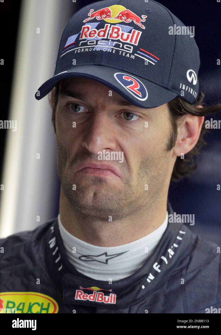 Red Bull driver Mark Webber of Australia reacts during the free ...