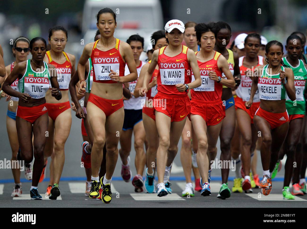 China's Zhu Xiaolin, center left, and her compatriot Wang Jiali, center ...