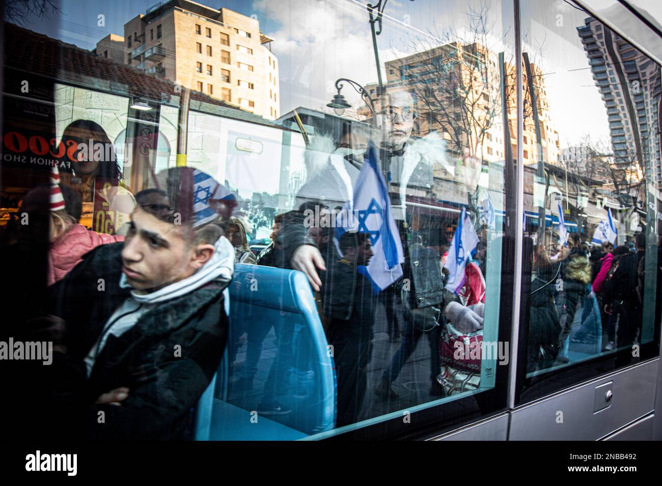 Jerusalem, Israel. 13th Feb, 2023. Passengers of the light rail look at ...