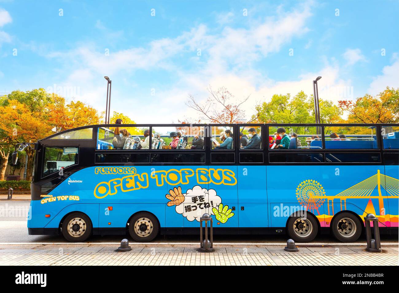 Fukuoka, Japan - Nov 21 2022: ACROS Fukuoka open top bus takes tourist ...