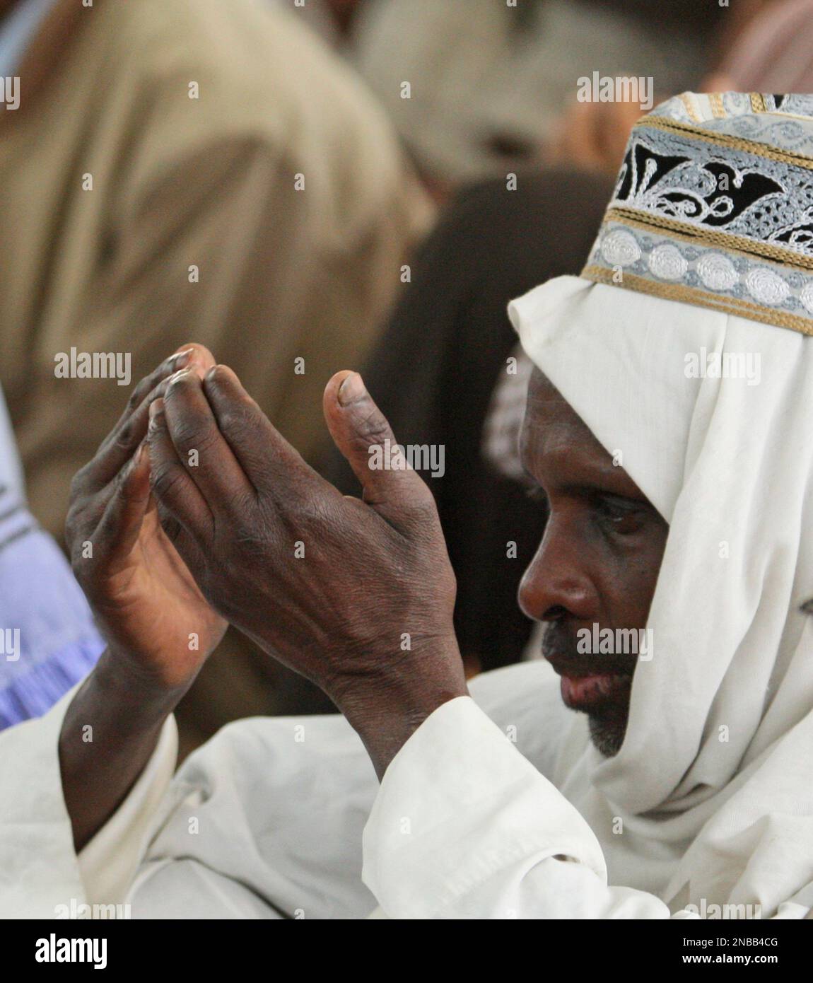 A Kenyan muslim in prayers during the last Friday of the holy month of ...