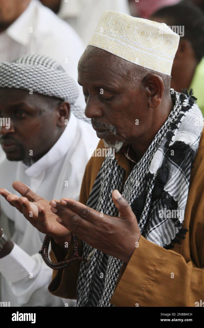 A Kenyan muslim in prayers during the last Friday of the holy month of ...