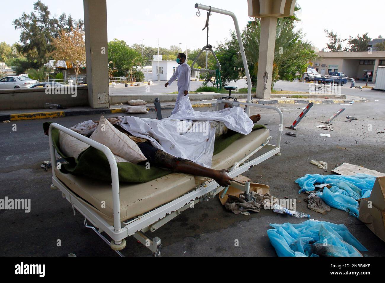 Libyan dead bodies lay in the hospital of Abu Salim district, in ...