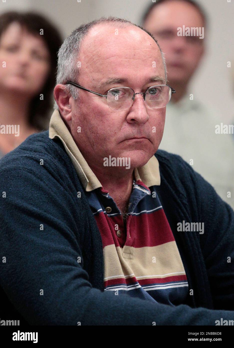 John P. Cushing Jr. listens during a court hearing brought by his ...