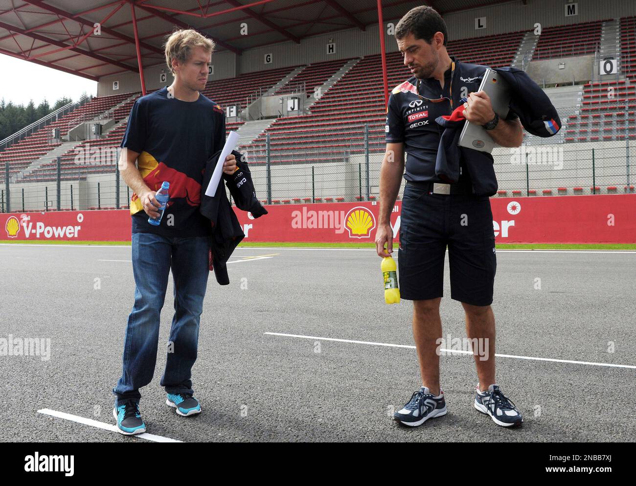 Red bull Racing driver Sebastian Vettel from Germany, inspects the ...