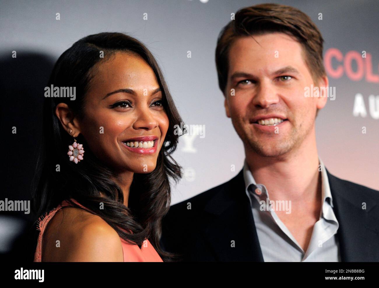 Zoe Saldana, left, star of the film "Colombiana," poses with her fiance ...