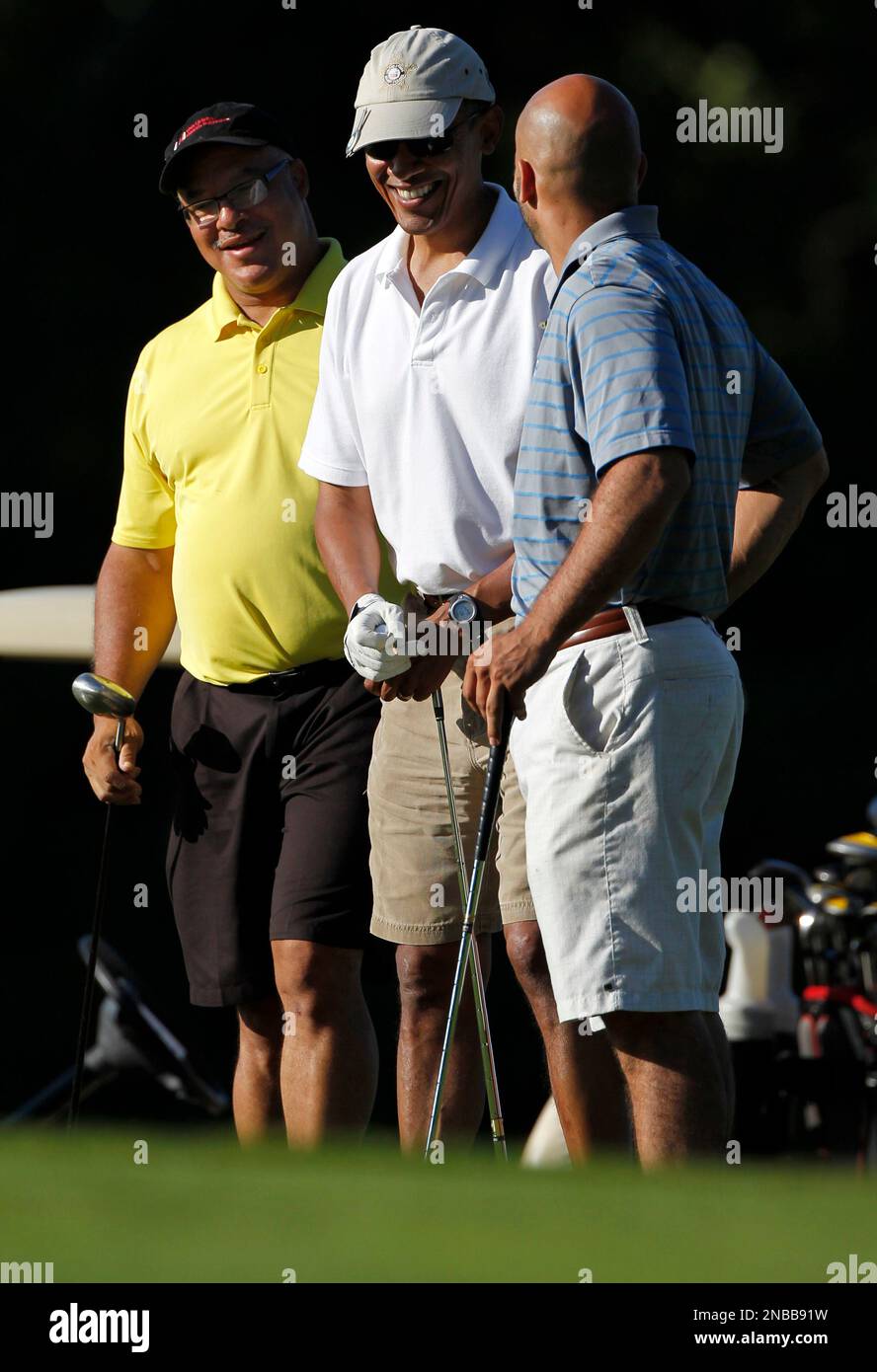 President Barack Obama, center, shares a light moment with Eric ...