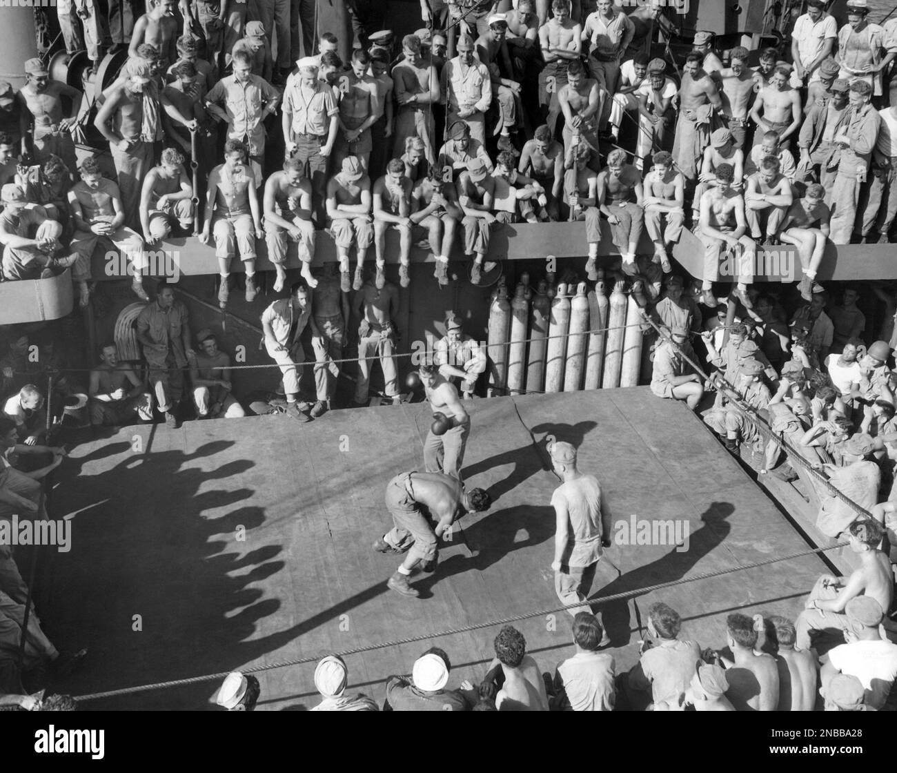 Pfc. Roger Bollinger (in ring), of Chelsea, Mass., scores knock-down on ...