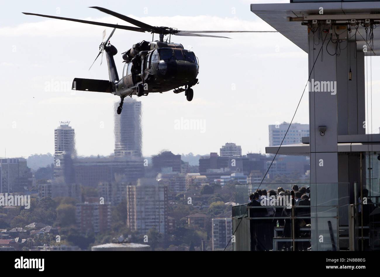 People on the 21st floor of a building watch an Australian Army ...