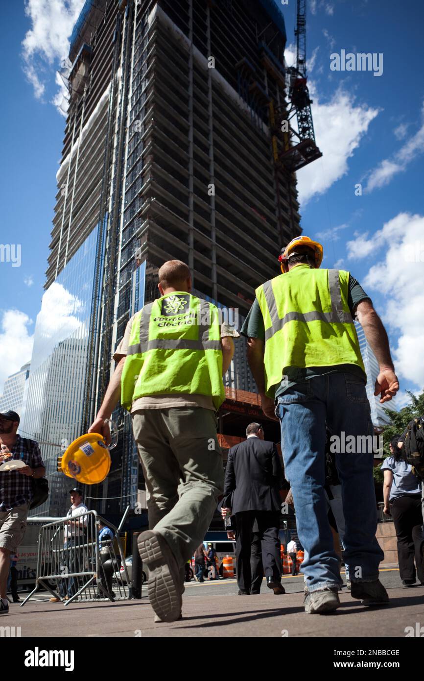 Construction workers at ground zero head back to work after an ...