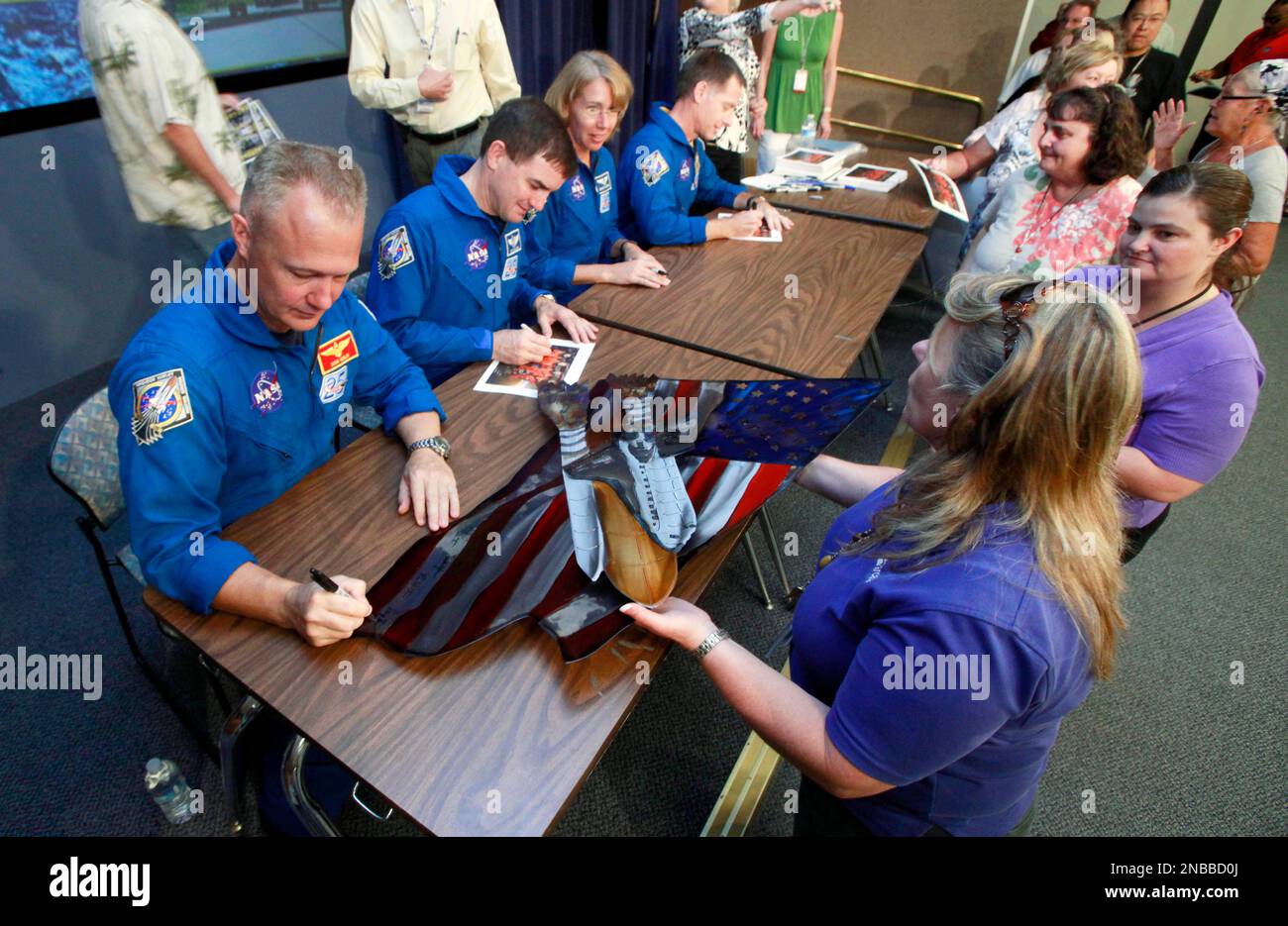 The crew of the last Space Shuttle mission, STS-135, from left, pilot ...