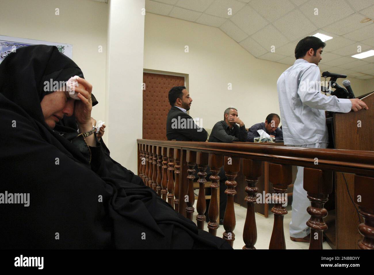 Ali Jamali Fashi, right, who has been charged with the killing a Tehran ...