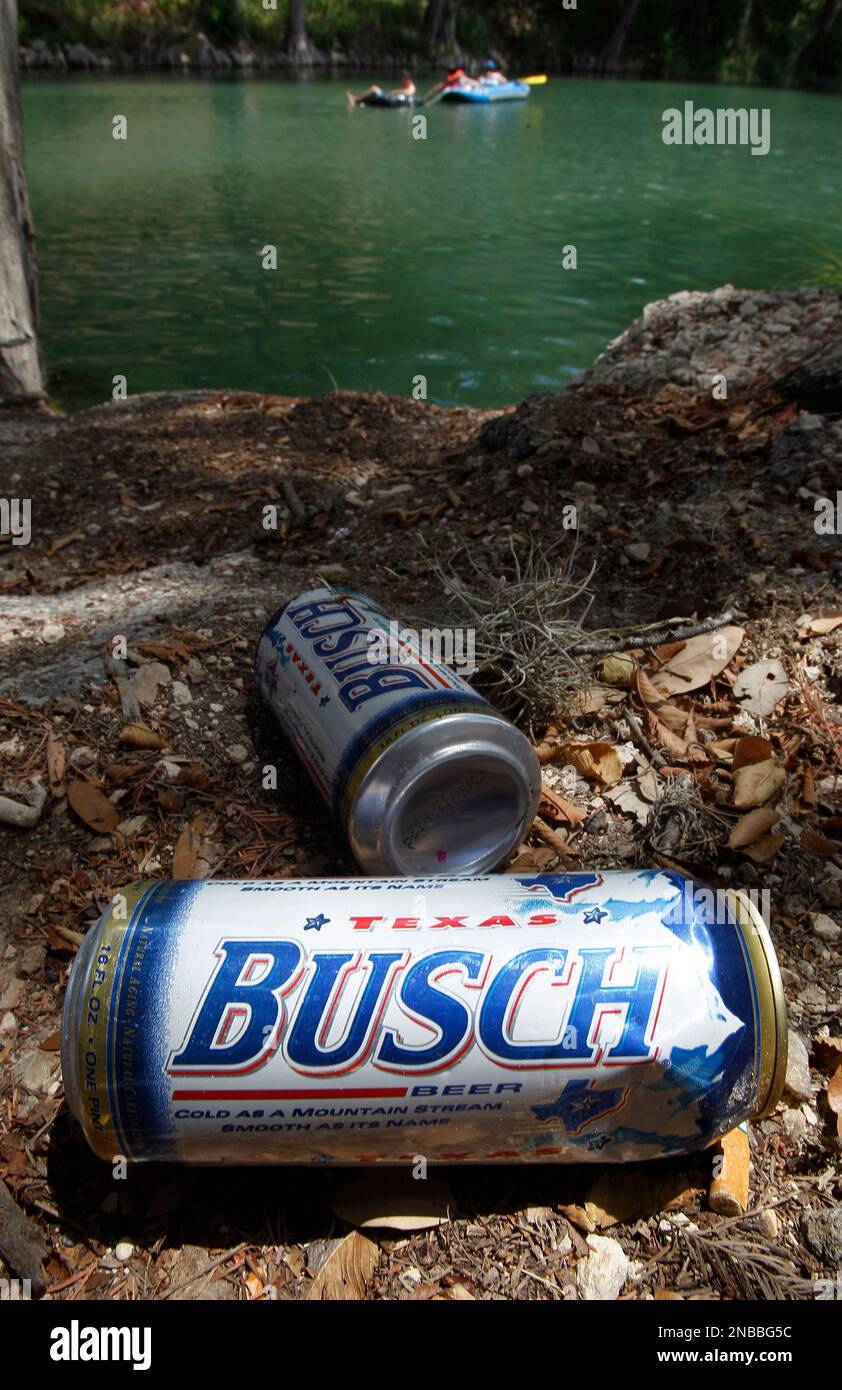Beer cans are seen along the Guadalupe River, Monday, Aug. 22, 2011, in ...
