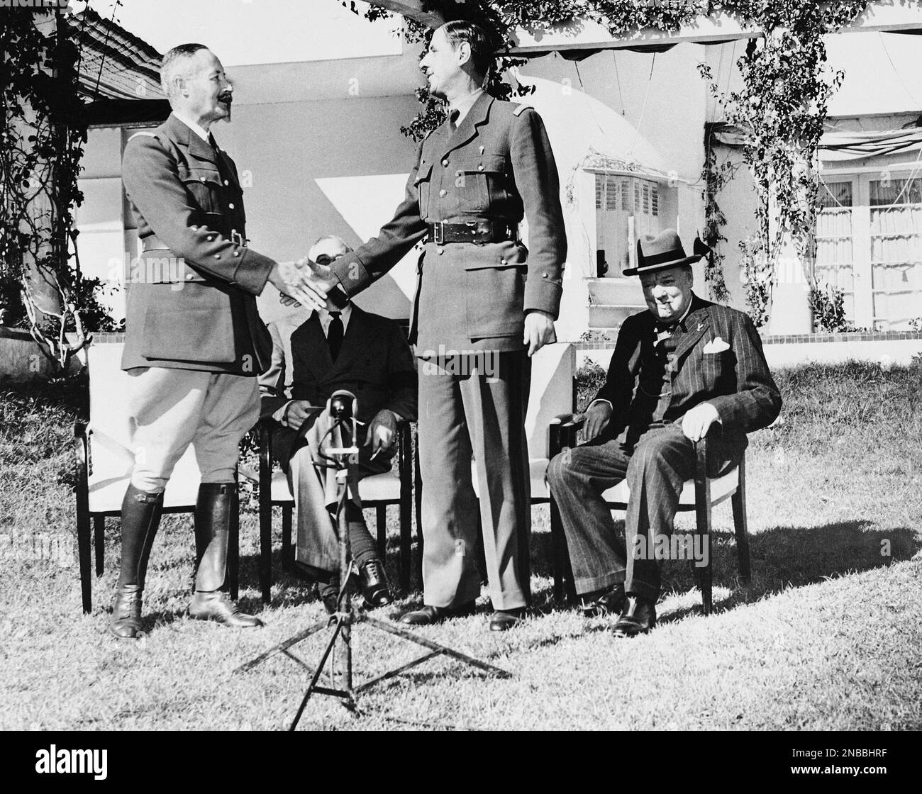 Gen. Charles de Gaulle and Gen. Henri Honore Giraud shake hands as ...