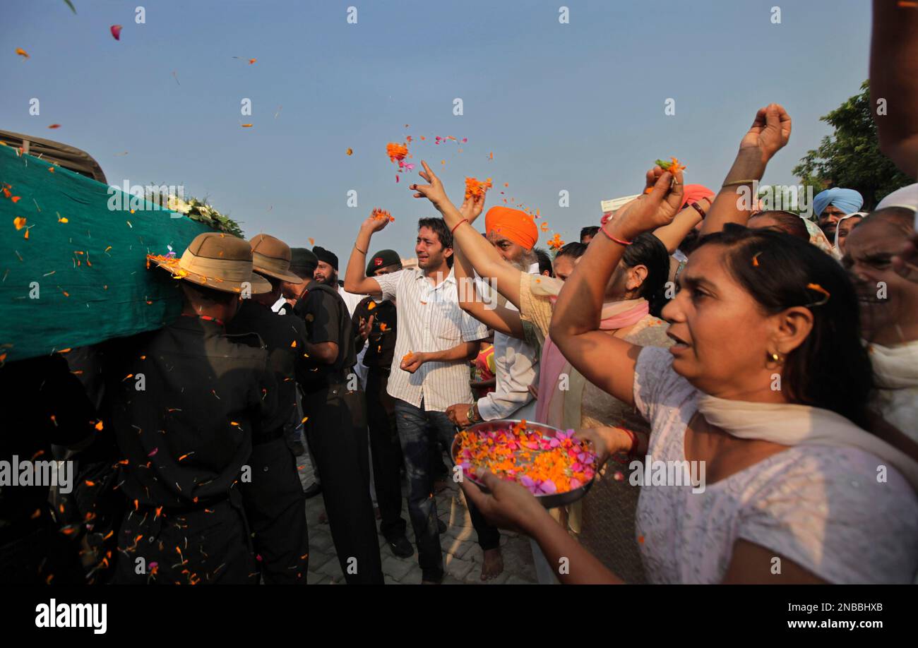 Relatives of slain Indian army officer Lt. Navdeep Singh shower flower ...