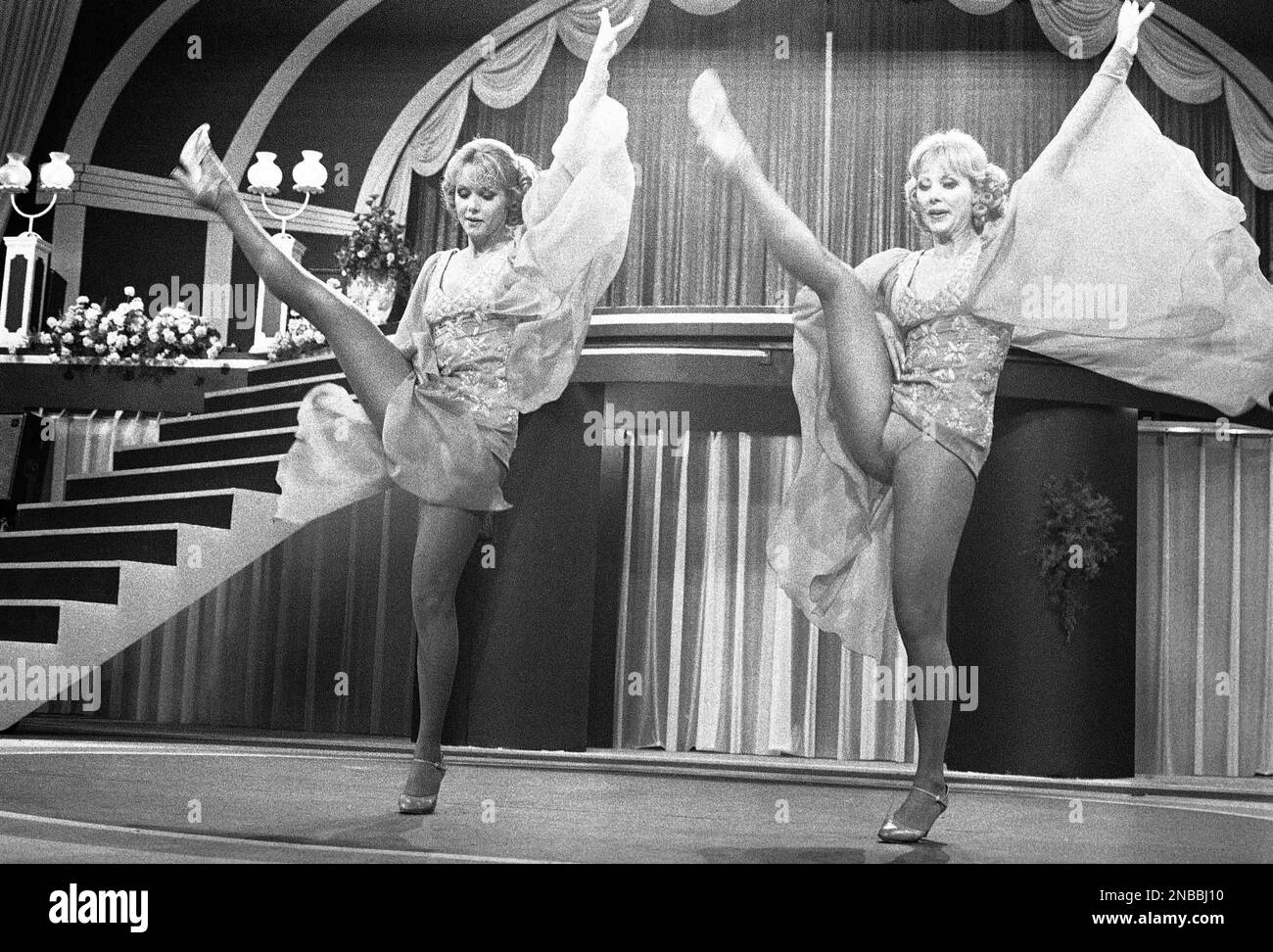 German twin dancers-actresses Alice and Ellen Kessler perform during a charity gala for the ...