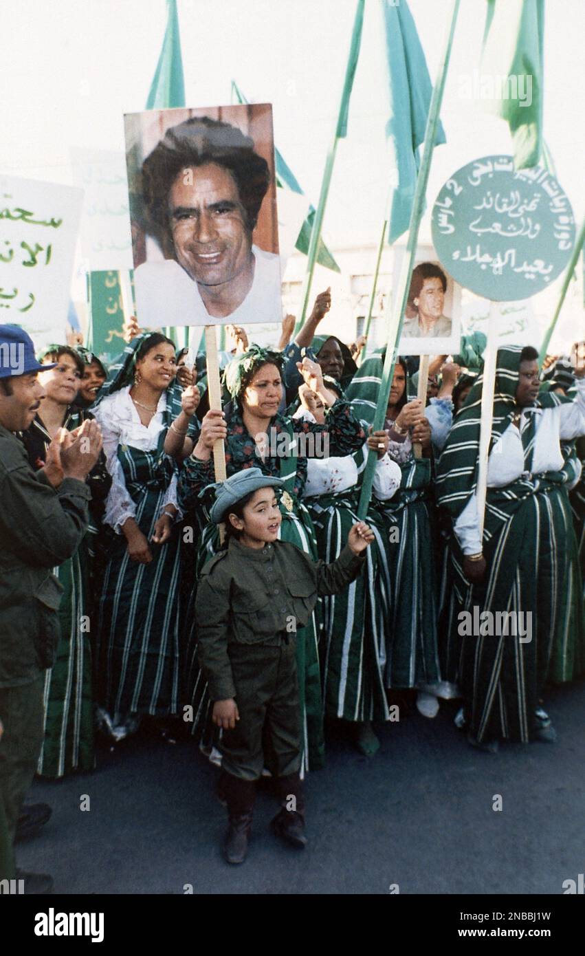 Libyan women wearing the national color of green demonstrate in support ...