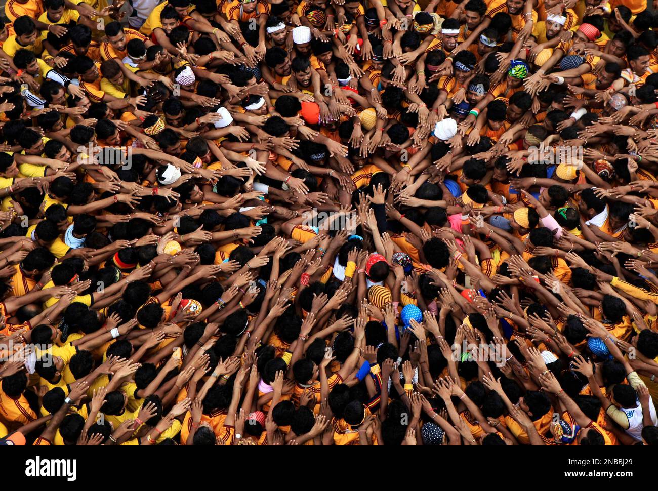 Indian youth make a human pyramid to reach and break the ‘Dahi Handi ...