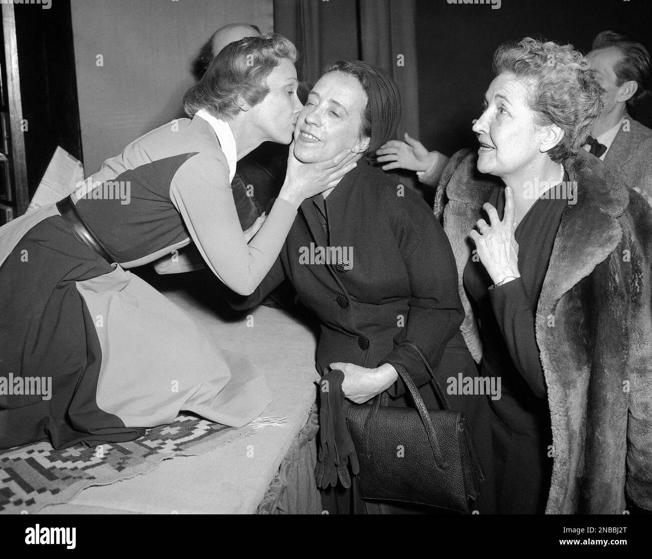 Romanian-born French actress Jany Holt kisses Italian fashion designer ...