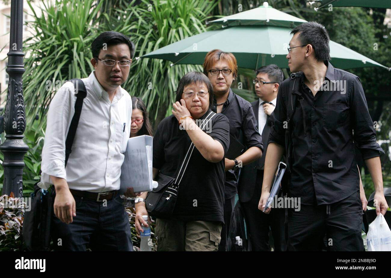 Hong Kong legislator James To, left, and lawyer Jonathan Man, right ...