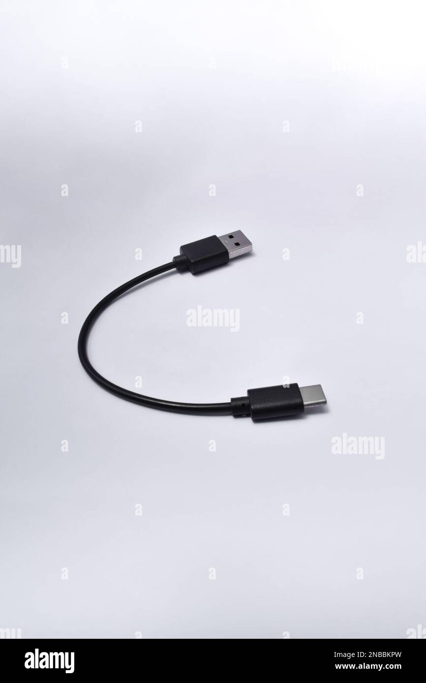 Black USB cable with plugs type A and type C isolated on a white ...