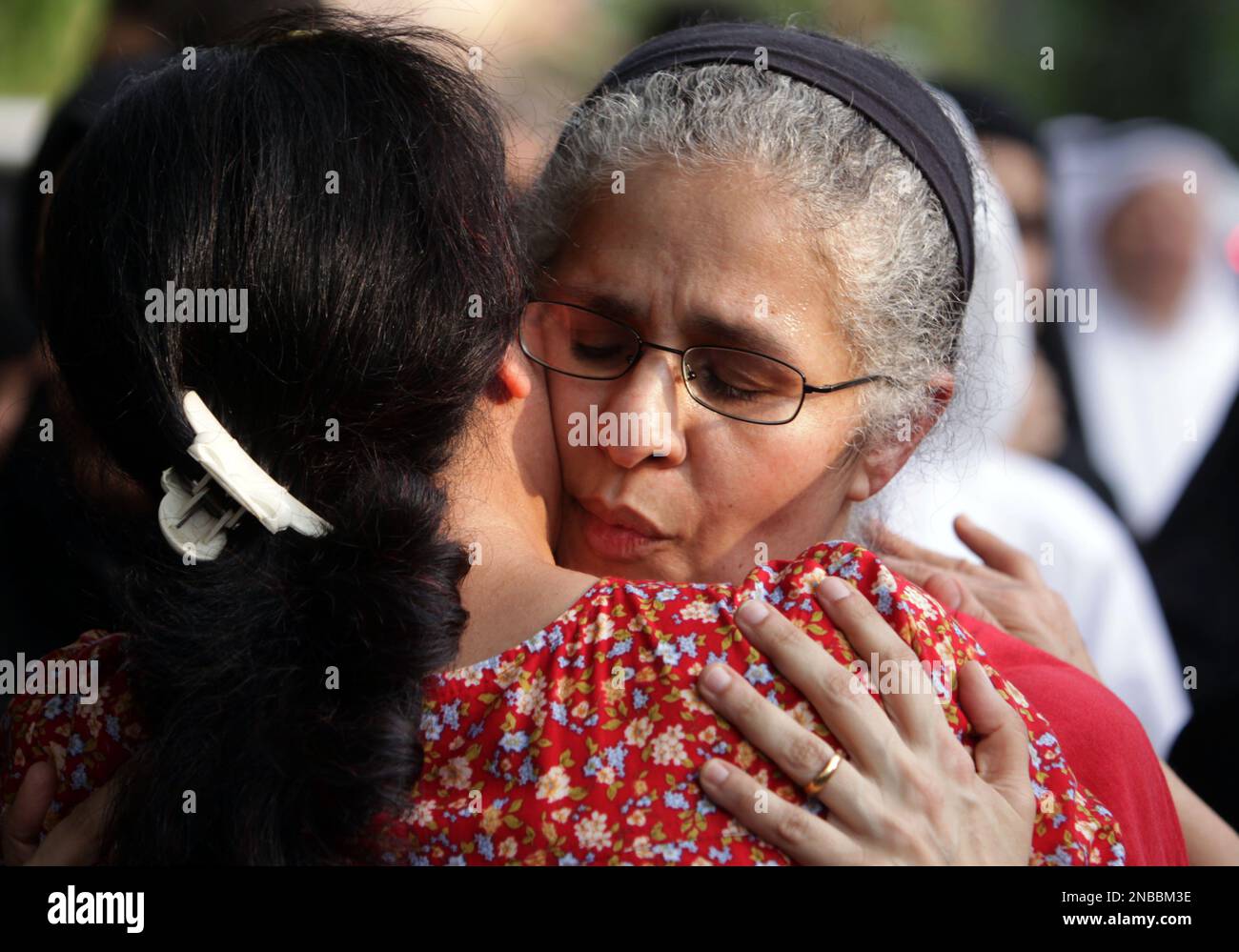 Rola al-Safar, Bahrain's top nursing official, right, hugs a wellwisher ...