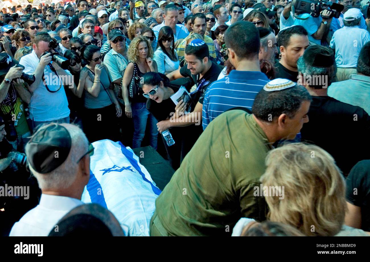 Viki Jan , daughter of Dov and Shula Karlinsky, mourns during their ...