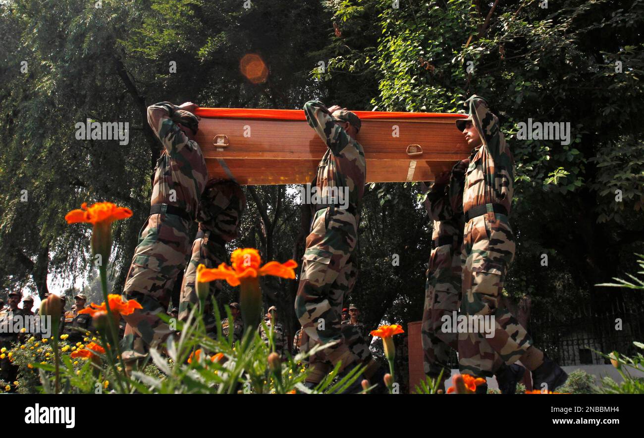 Indian Army soldiers carry the coffin of their colleague who was killed ...