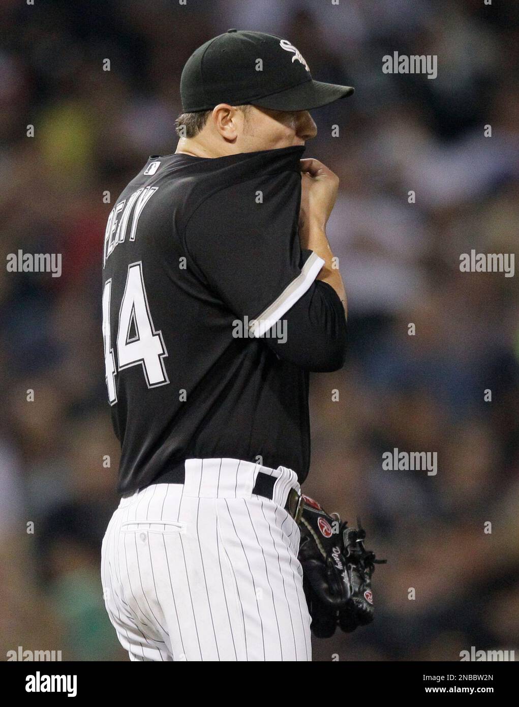 Chicago White Sox starter Jake Peavy wipes his face after giving up a ...