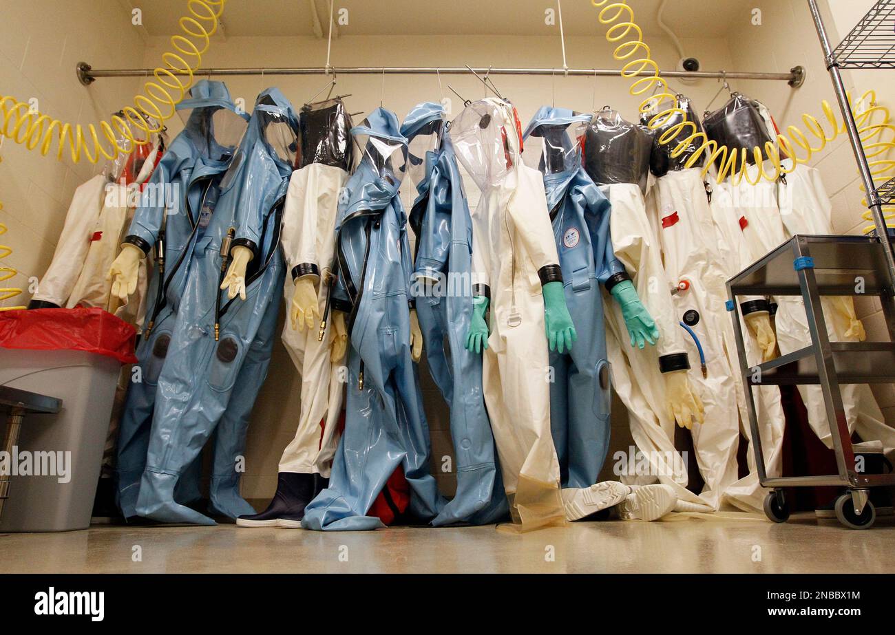 Biohazard suits hang in a Biosafety Level 4 laboratory at the U.S. Army ...