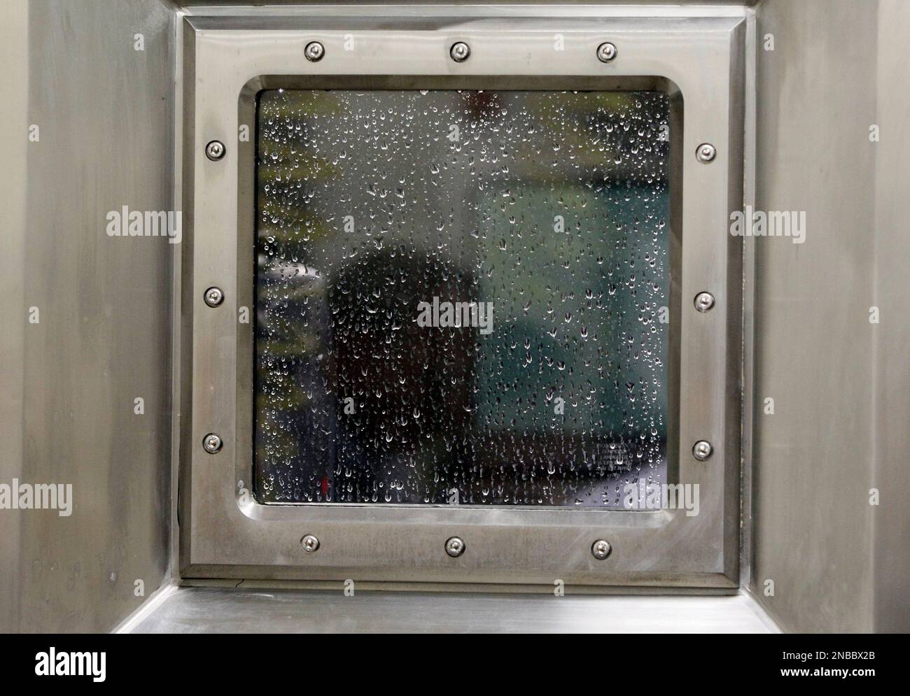 A window looks into a chamber in a Biosafety Level 4 laboratory at the ...