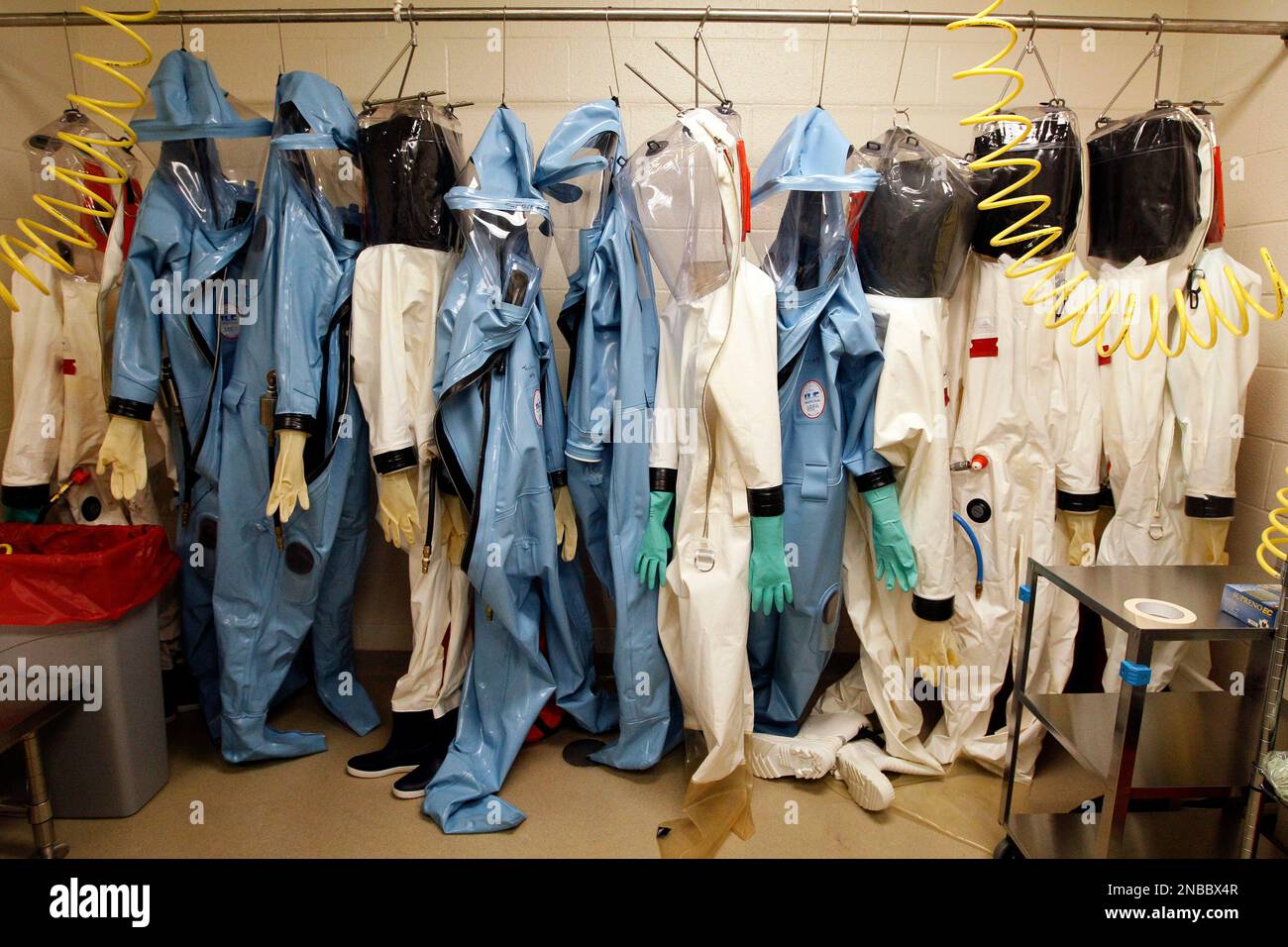 Biohazard suits hang in a Biosafety Level 4 laboratory at the U.S. Army ...