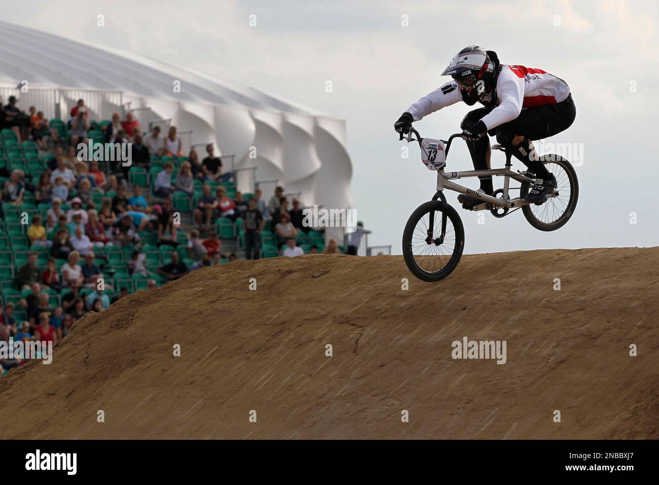 Backdropped by the basketball arena, Switzerland's Roger Rinderknecht ...