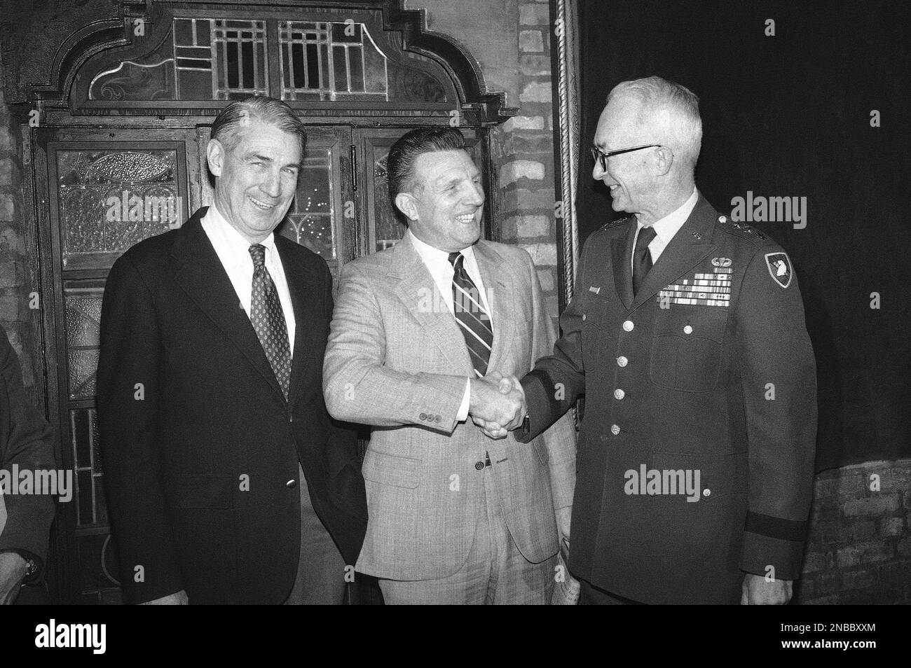 Coach Lou Saban shakes hands in New York on Friday, Jan. 5, 1979, with ...