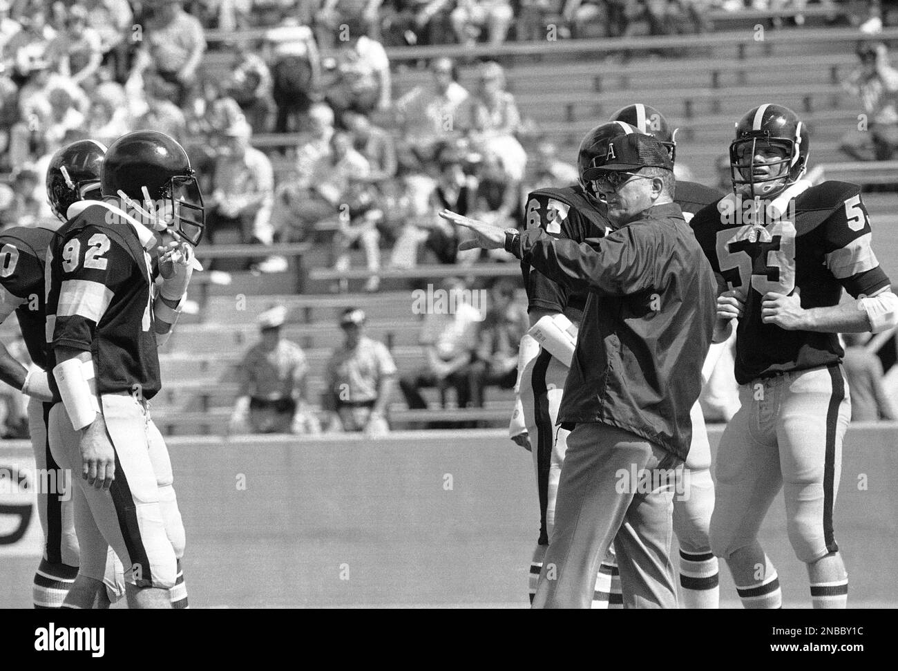New Army Football coach Lou Saban gives instructions to players Greg ...