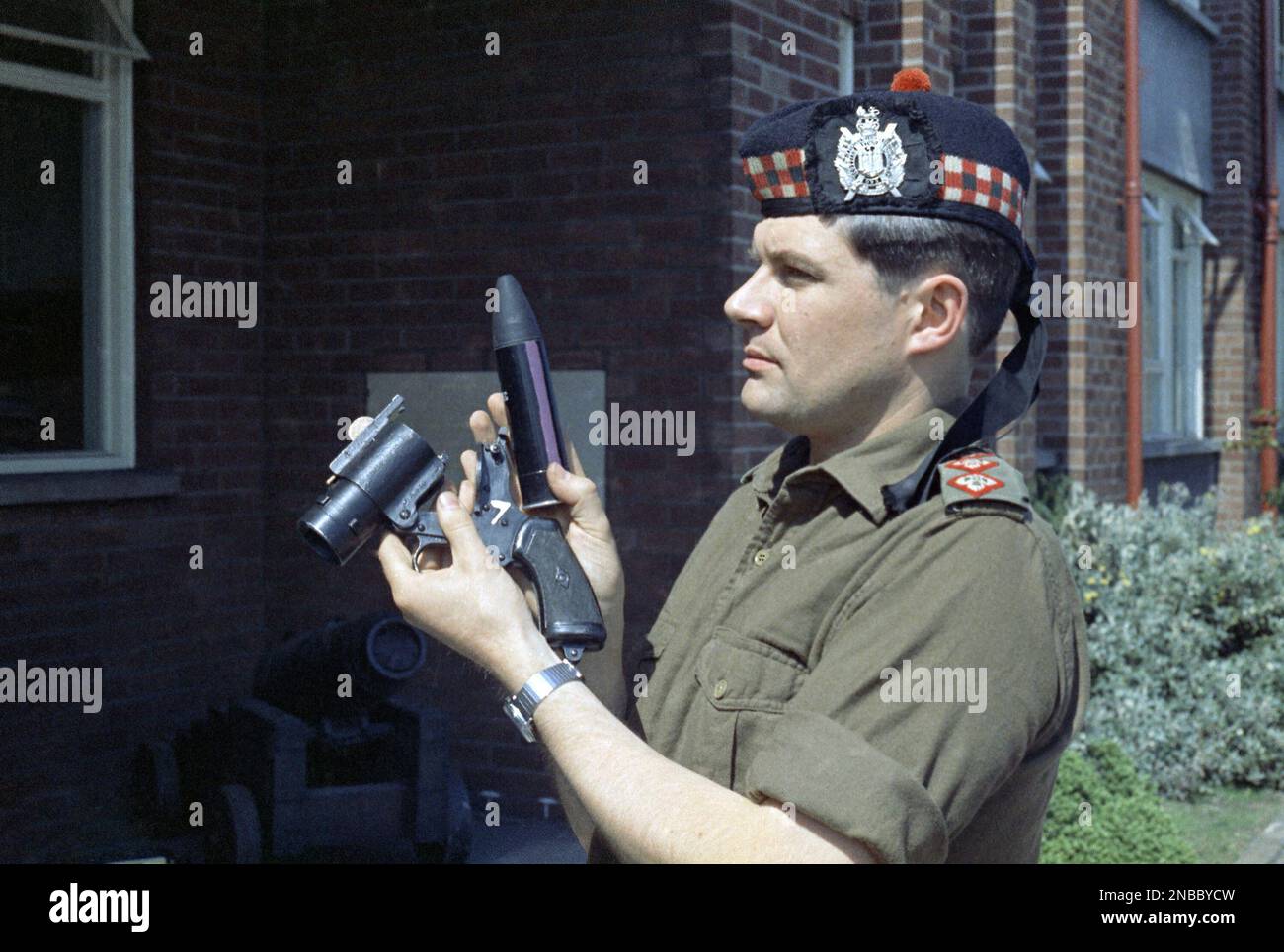 Captain Young of the King's Own Scottish Borderers holds the British ...
