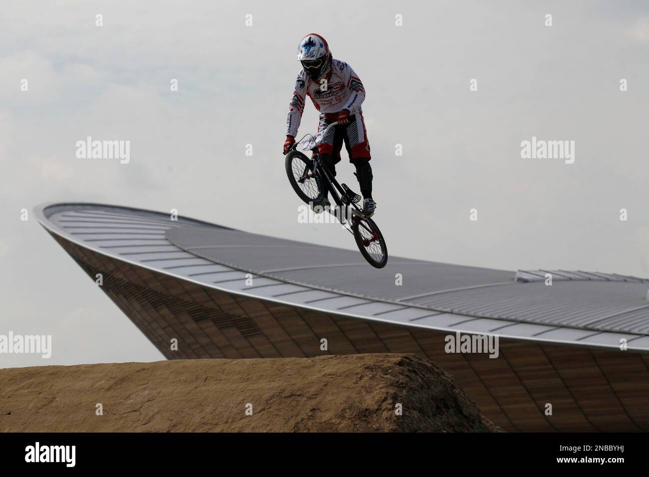 Backdropped by the velodrome Japan's Masahiro Sampei jumps during the ...