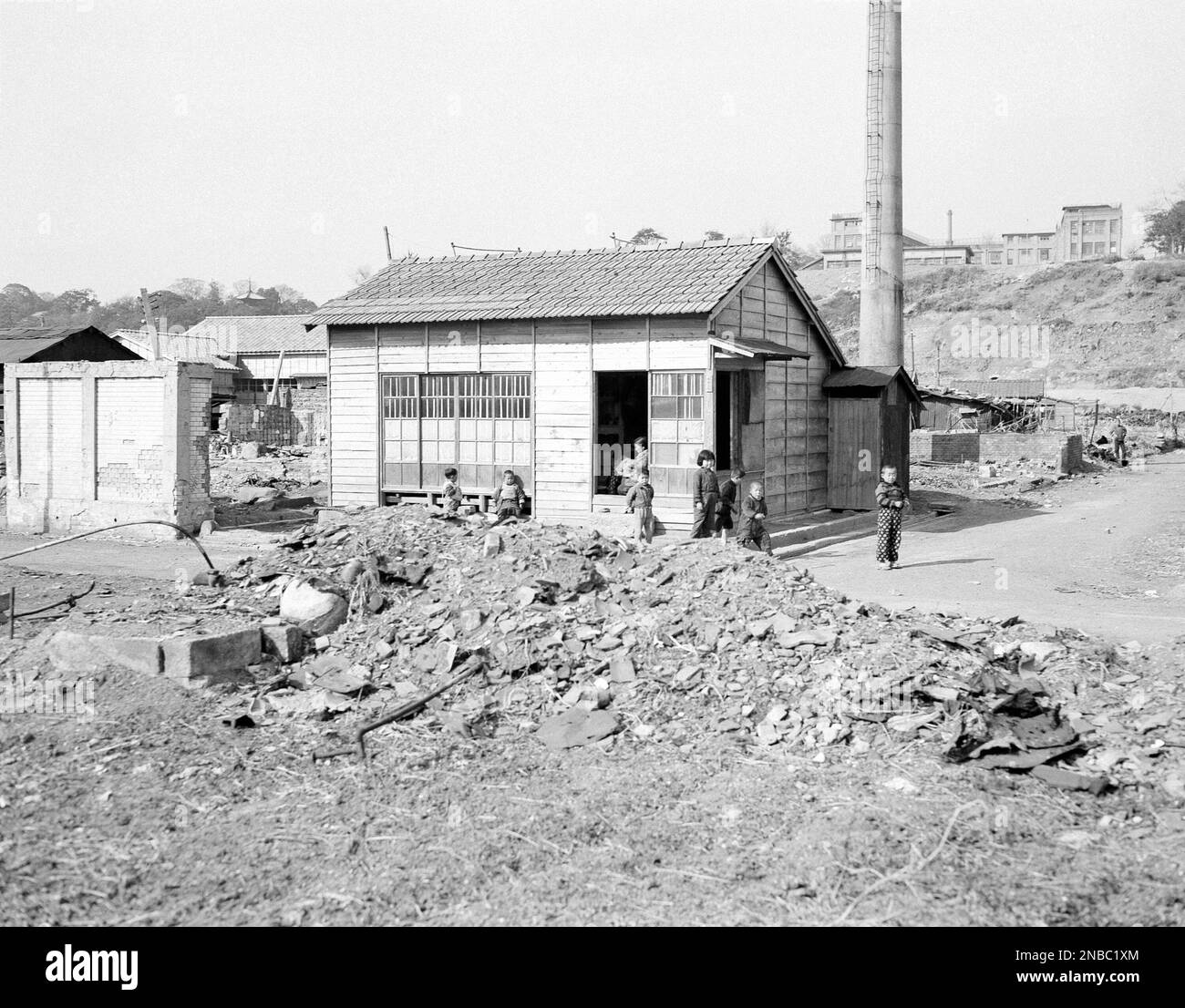 Children playing in the ramshackle area that has been built up in the ...