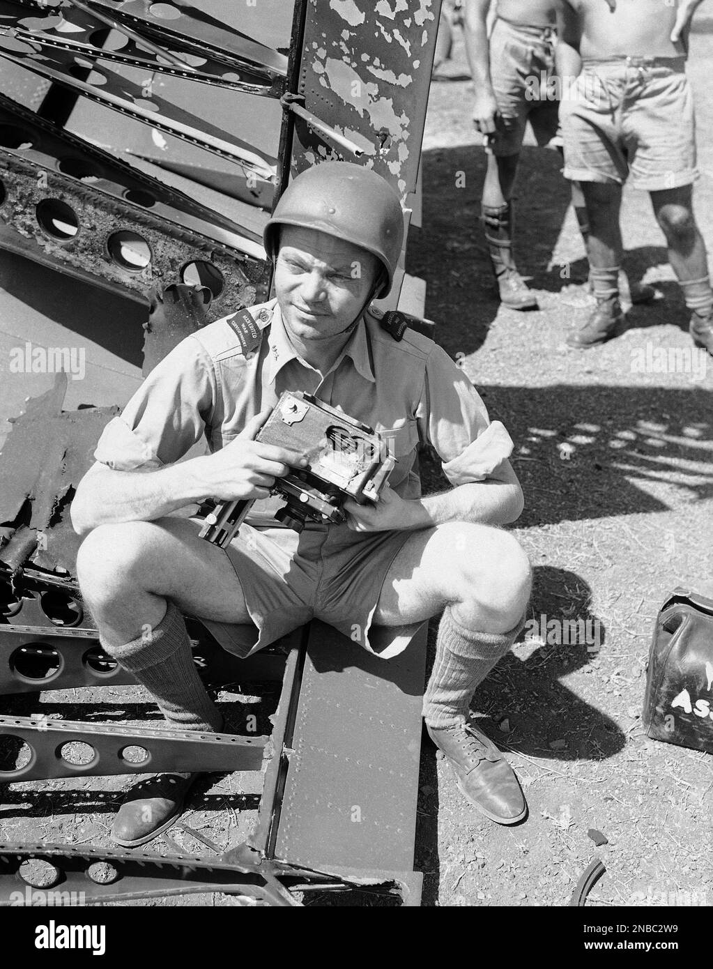 Following a surprise Japanese air raid on a New Guinea based Associated ...