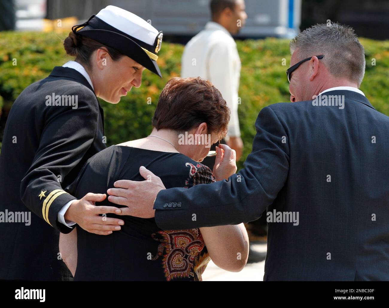 Maggie O'Brien, center, an aunt of the deceased, is escorted away after ...