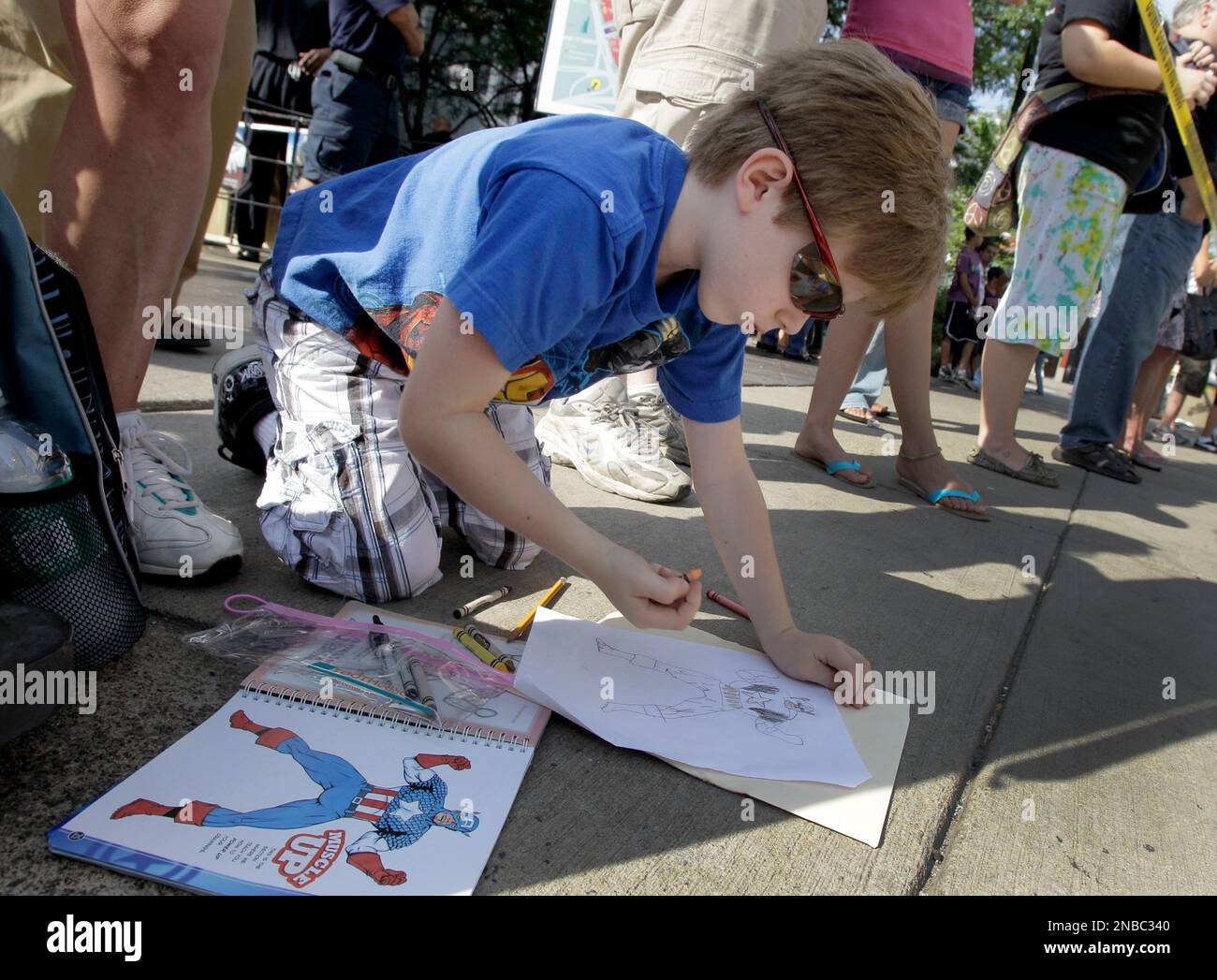 Behind a police barricade, Dominic Sidoti, 7, of Brunswick, Ohio colors ...