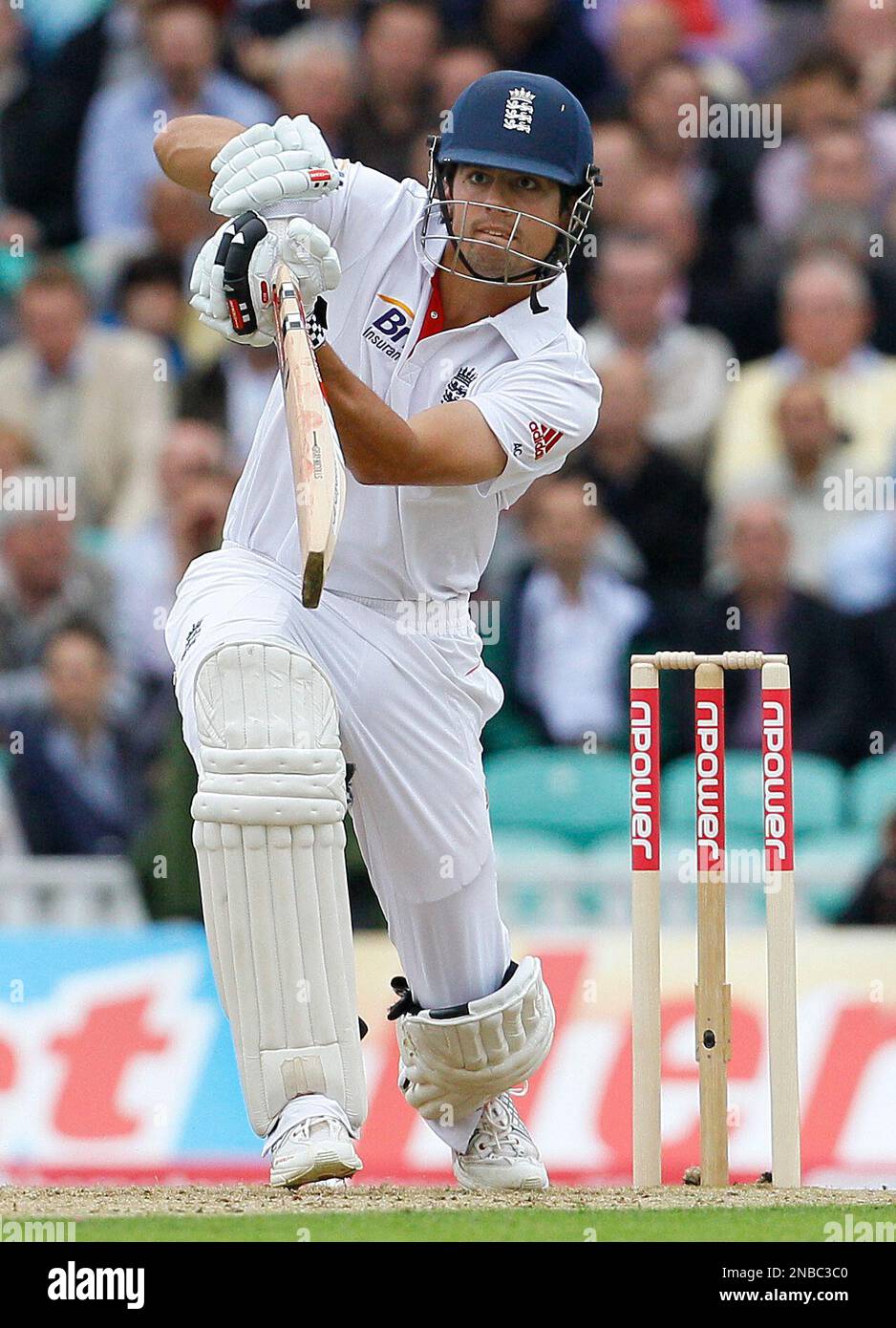 England's Alastair Cook plays a shot off the bowling of India's ...