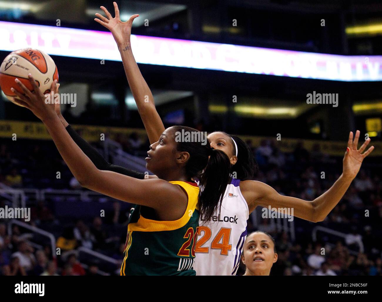 Seattle Storm's Camille Little, left, drives past the Phoenix Mercury's ...