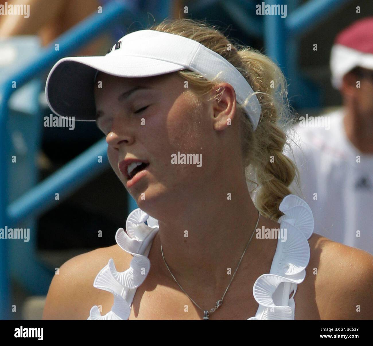 Caroline Wozniacki, from Denmark, reacts after missing a shot during a ...