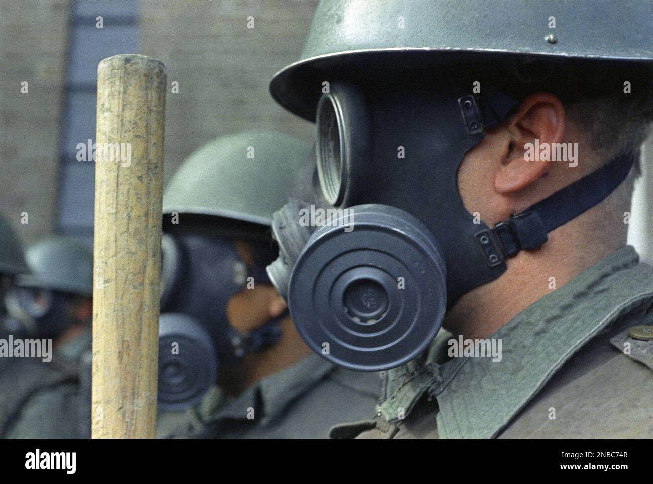 British Army Riot Squad troops wearing gas masks, bullet proof vests ...