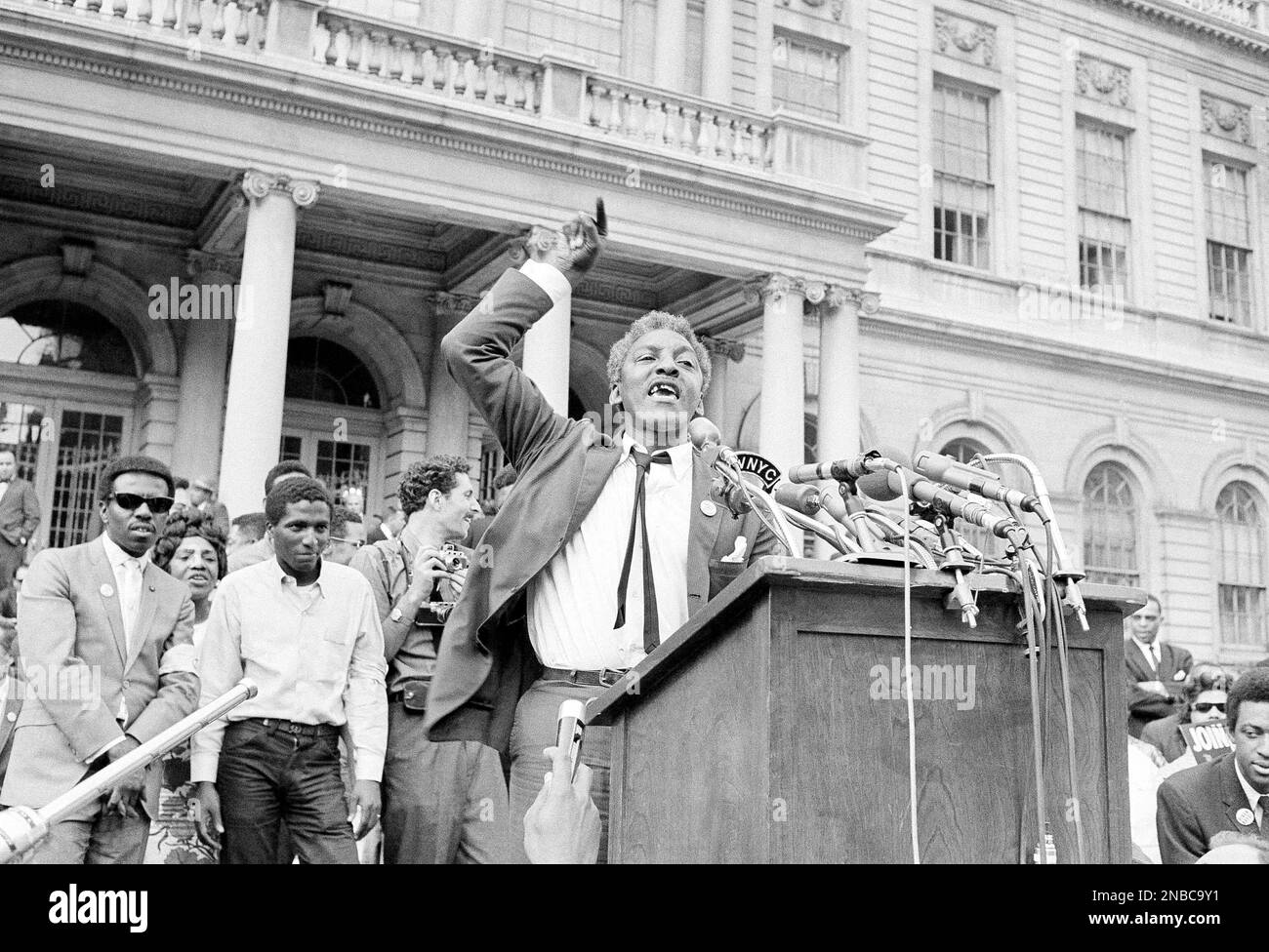 Bayard Rustin, civil rights organizer, speaks from platform erected in ...