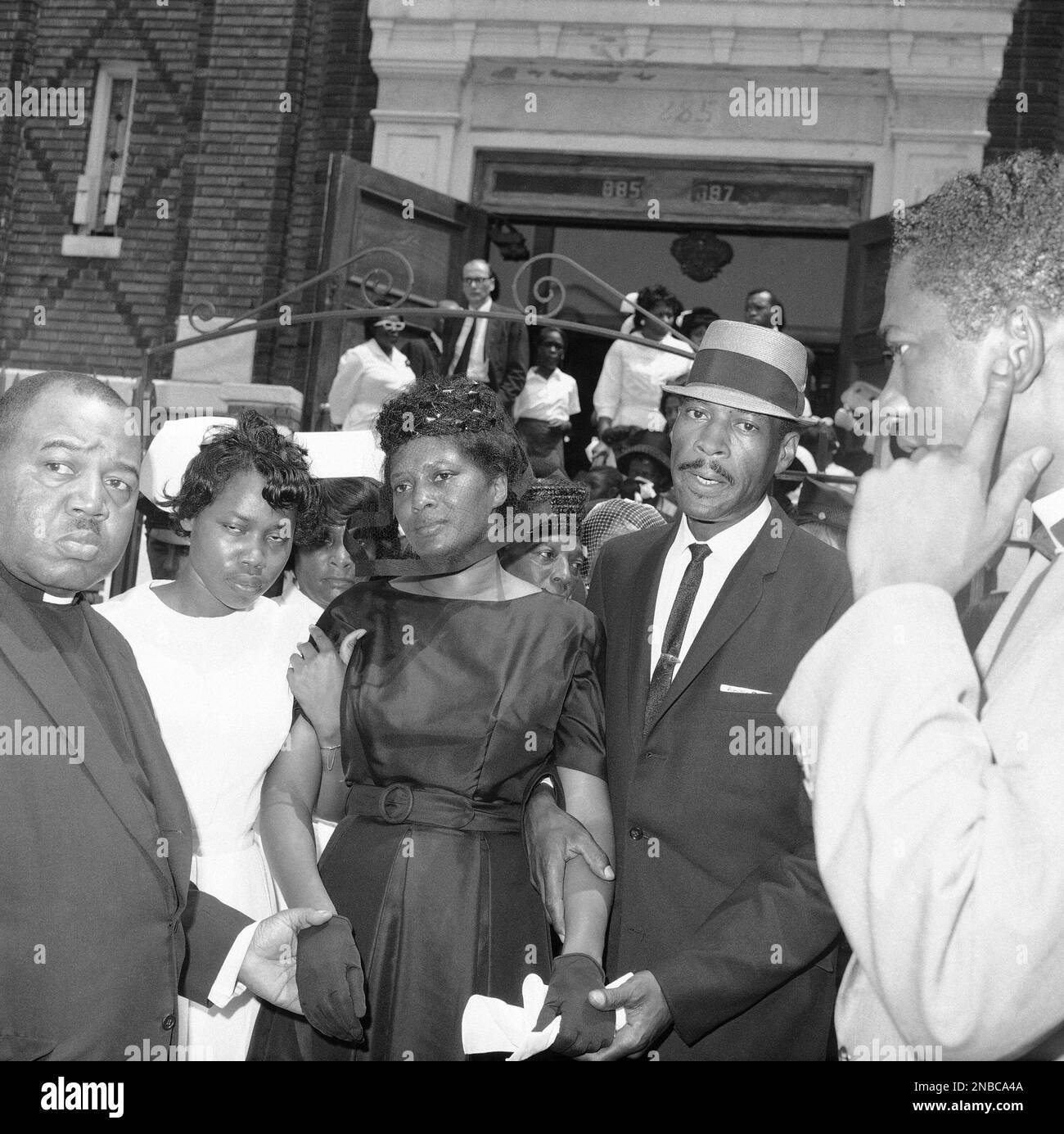 Alvita Dean, center, is assisted from church after funeral services for ...