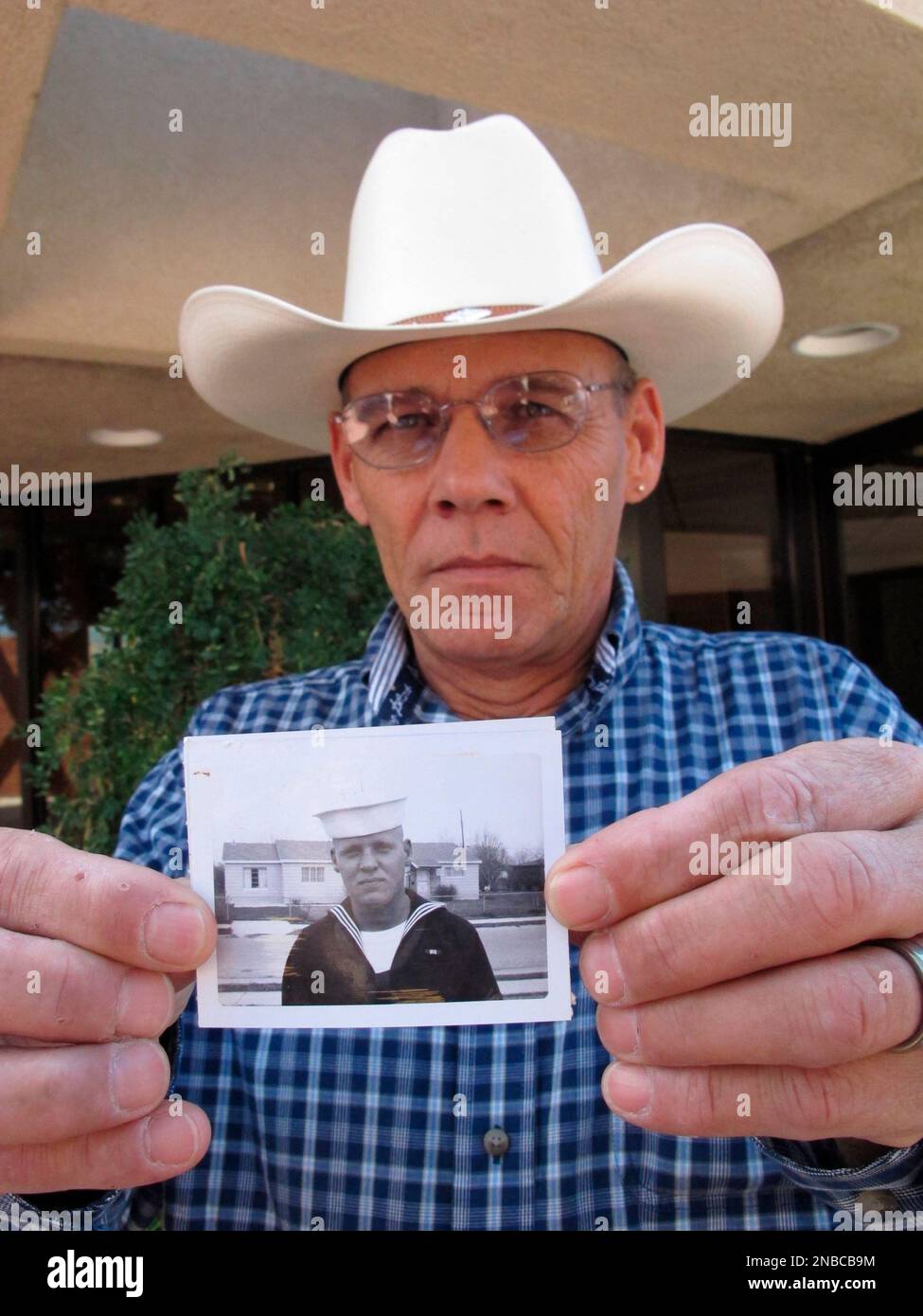 Randall Hester shows a photo of his older brother, Ron, during a ...