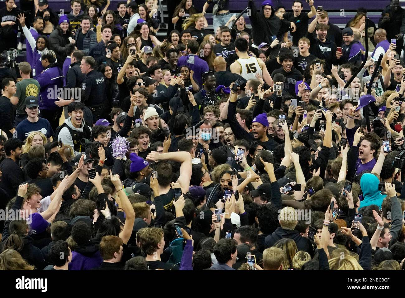 Northwestern players celebrate with fans after Northwestern defeated ...